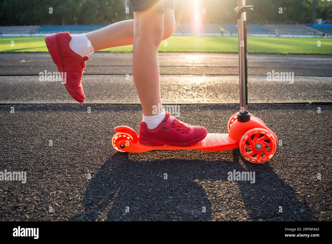 Little boy is riding scooter. Seasonal child activity sport Stock Photo ...
