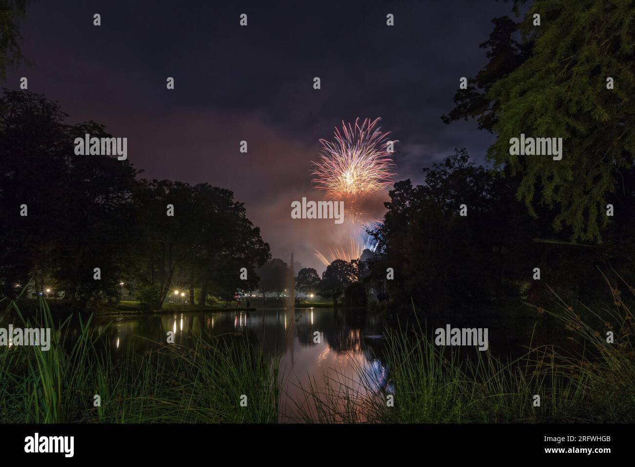 fireworks over a ruined castle over a city. beautiful fireworks with ...