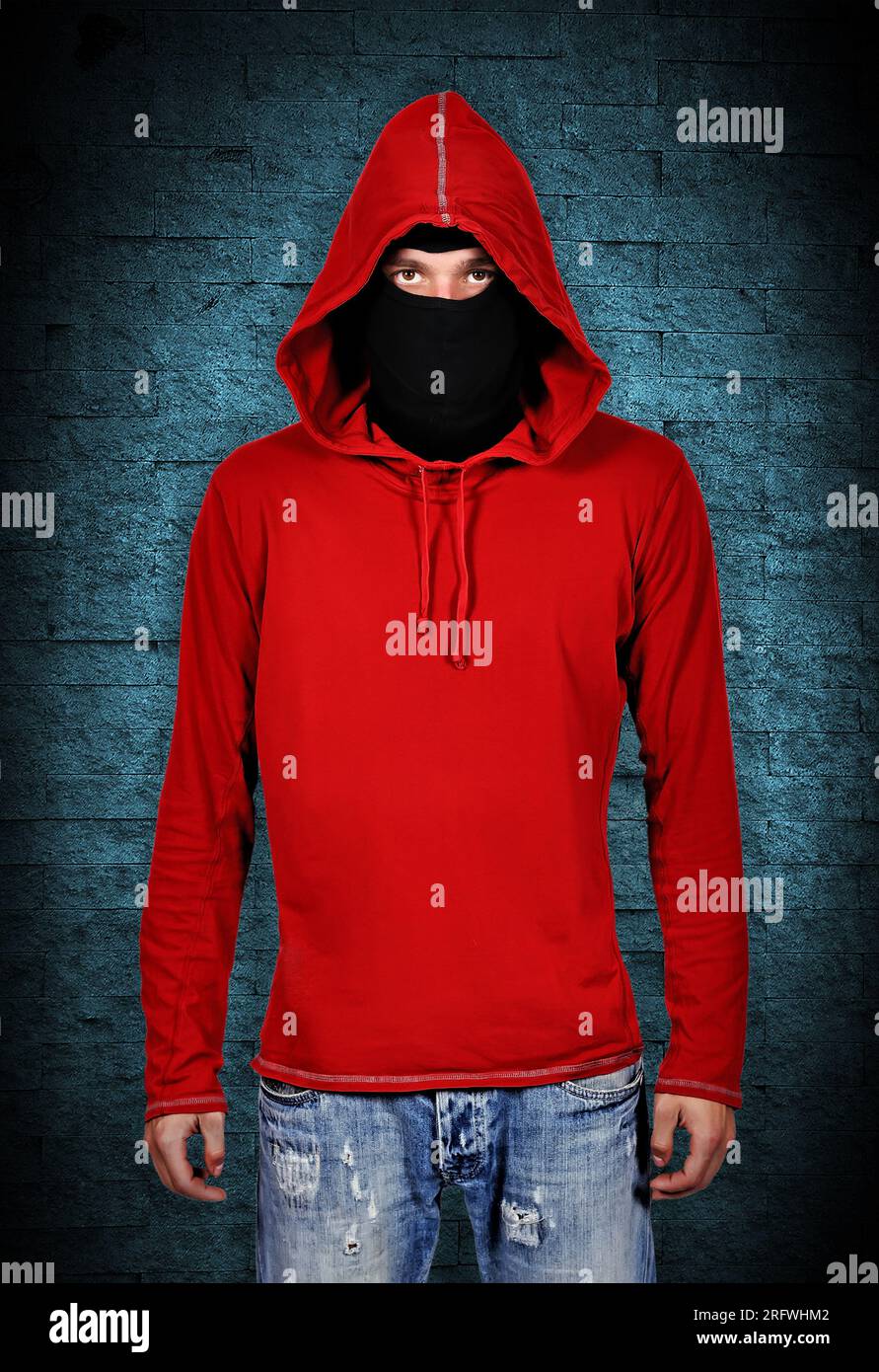street hoodlum in mask on a blue background Stock Photo - Alamy