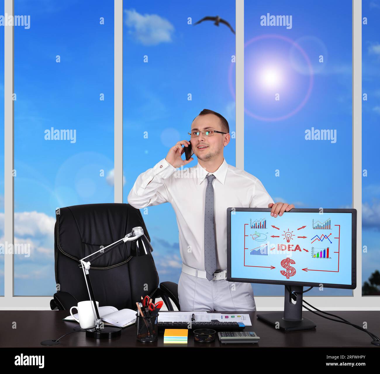 businessman in office and monitor with business scheme Stock Photo - Alamy