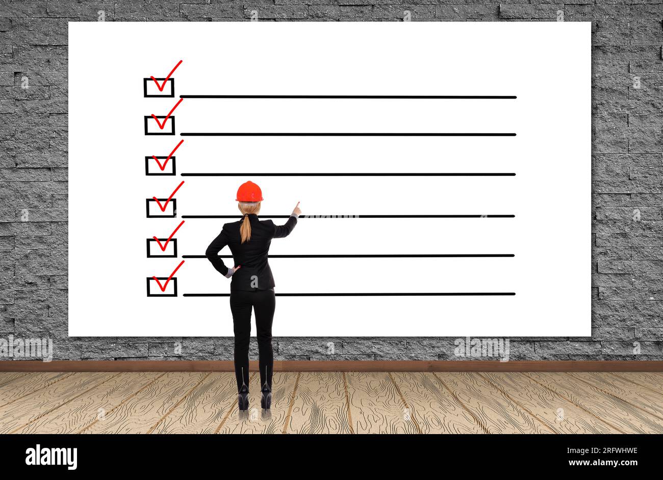 engineer woman pointing to placard with checklist Stock Photo - Alamy