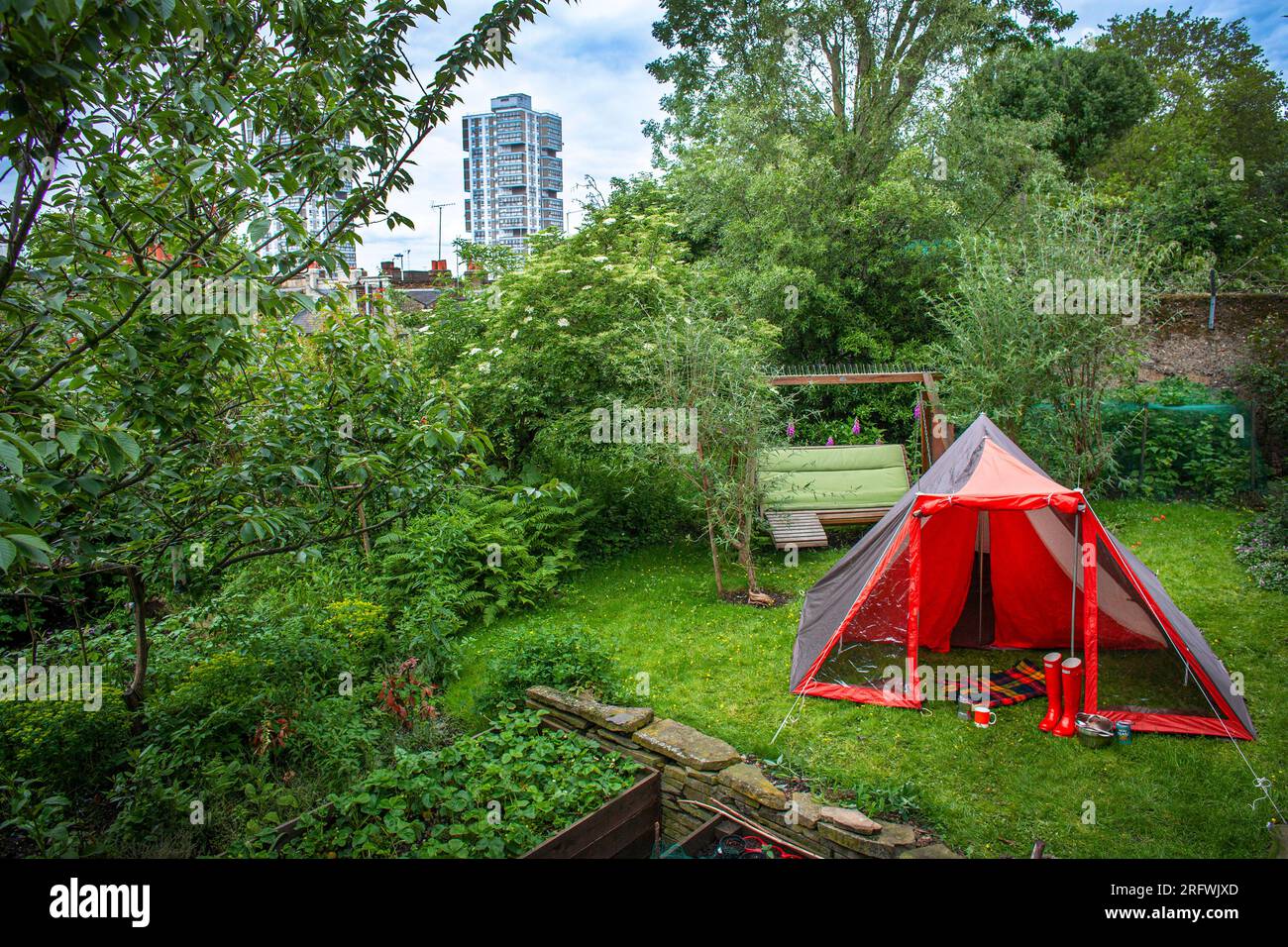 Red tent on a lawn in backyard garden , London , United Kingdom Stock ...