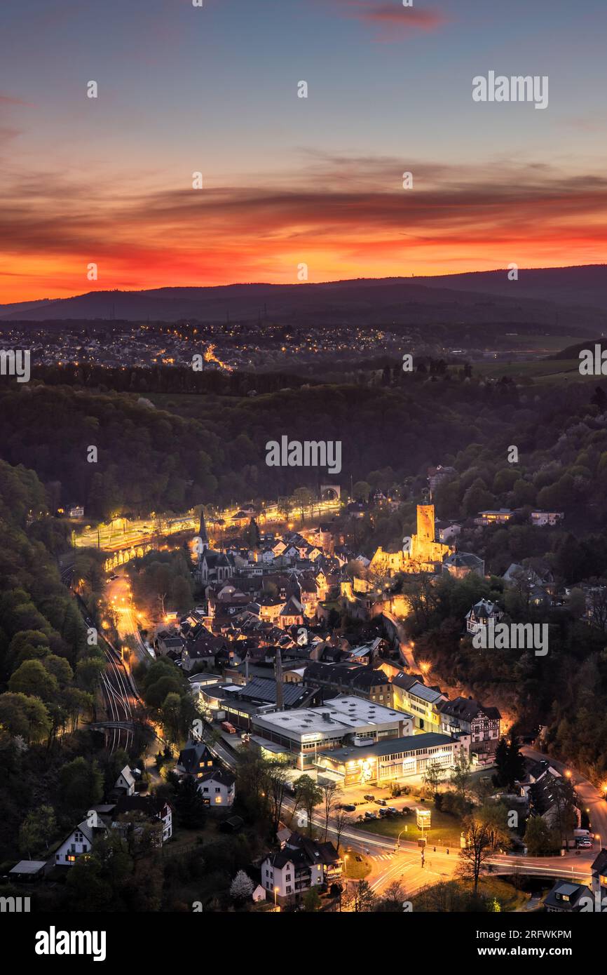 Backlit shot on a mountain with a view of the landscape, sunset, forest ...