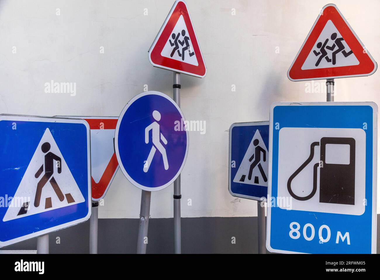 Road signs are installed on a street in a city center Stock Photo - Alamy