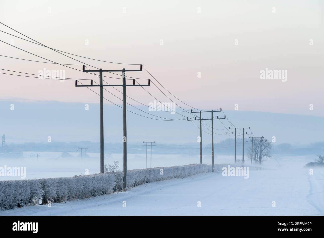 Snow and ice telegraph poles hi-res stock photography and images - Alamy