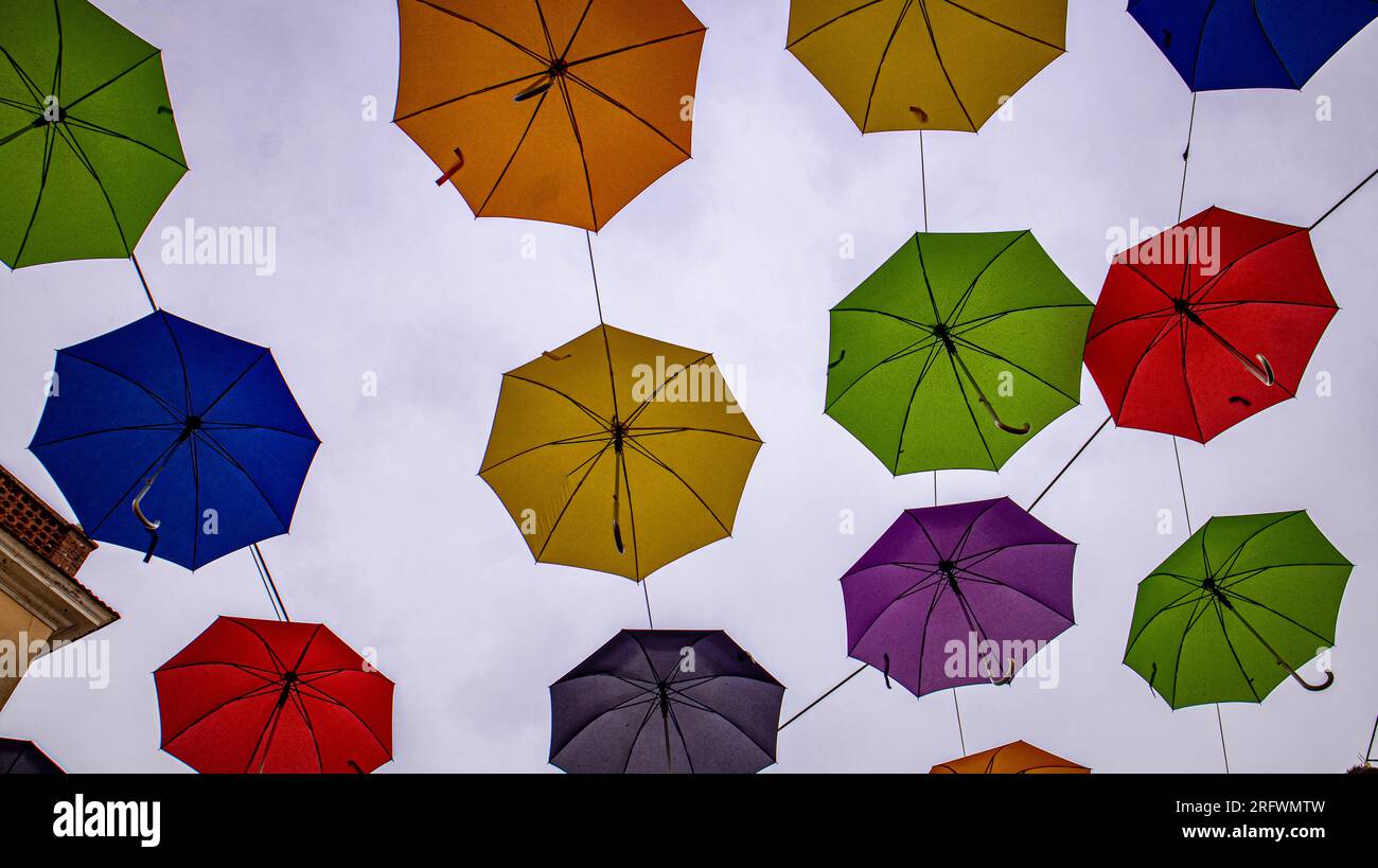 Colorful umbrellas in the sky, italy Stock Photo - Alamy