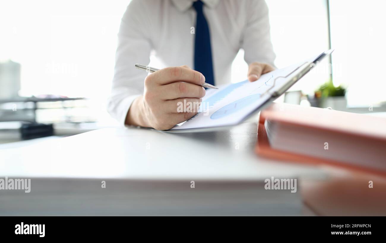 Workplace with folder and account Stock Photo - Alamy