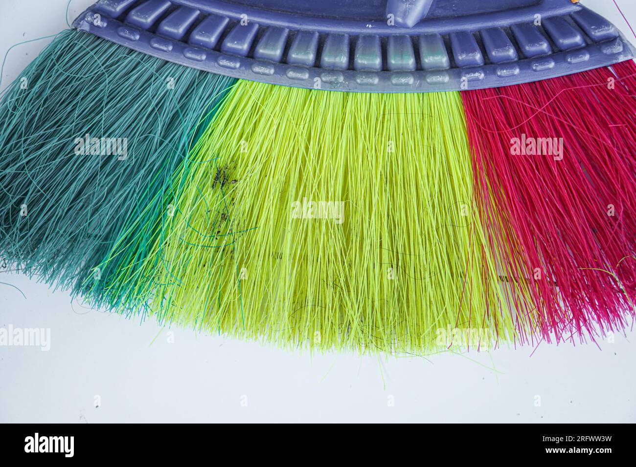 Colorful plastic broom close up picture Stock Photo - Alamy