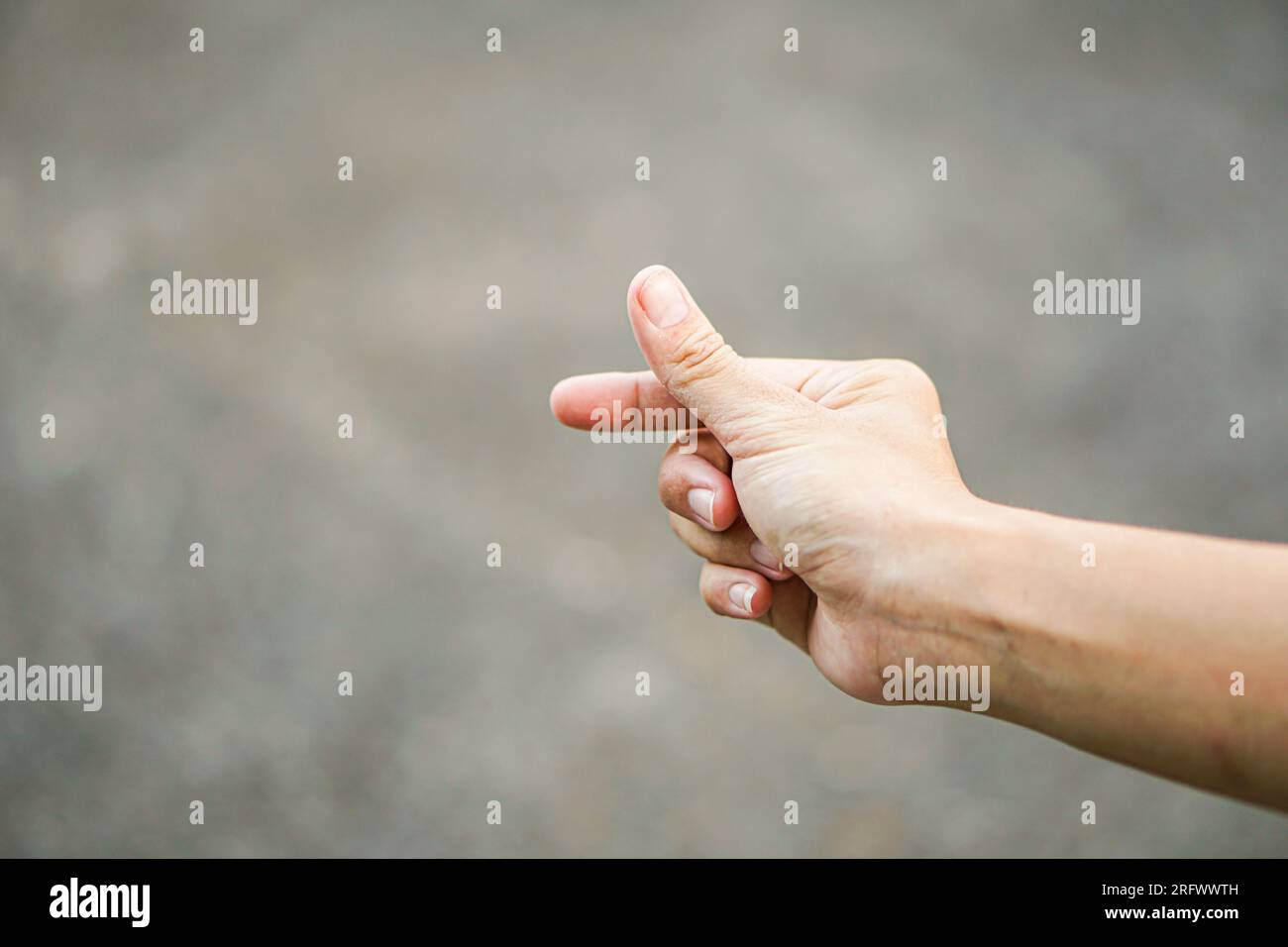 A hand signs gesture to be little heart from tip of thumb and index ...