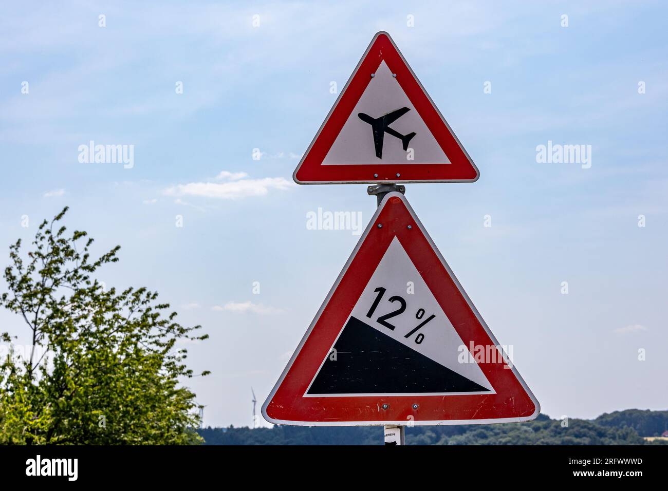 Traffic signs indicating: airport warning sign or low flying airplane ...