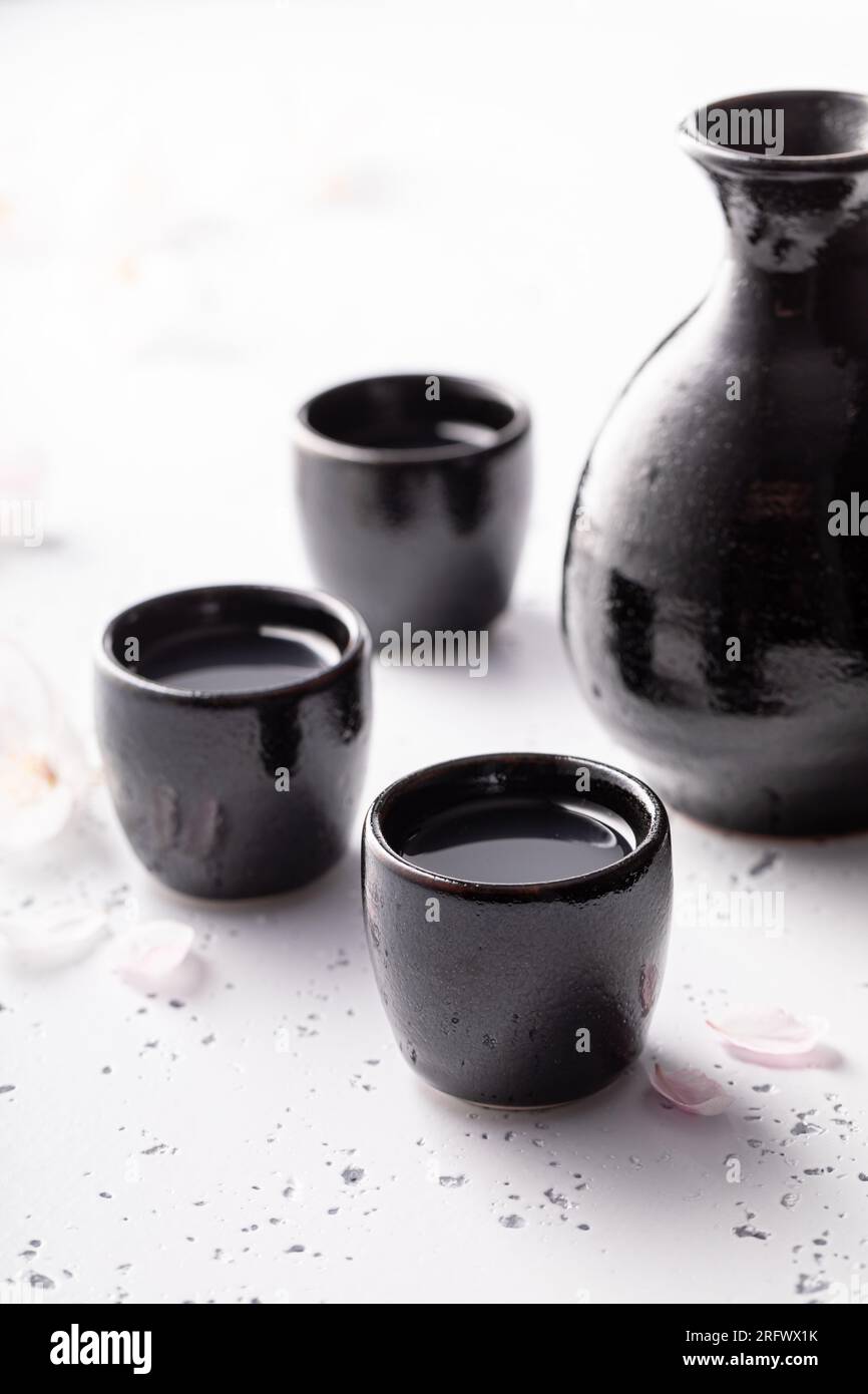 Special Japanese sake in black small ceramics. Served sake in ceramics ...