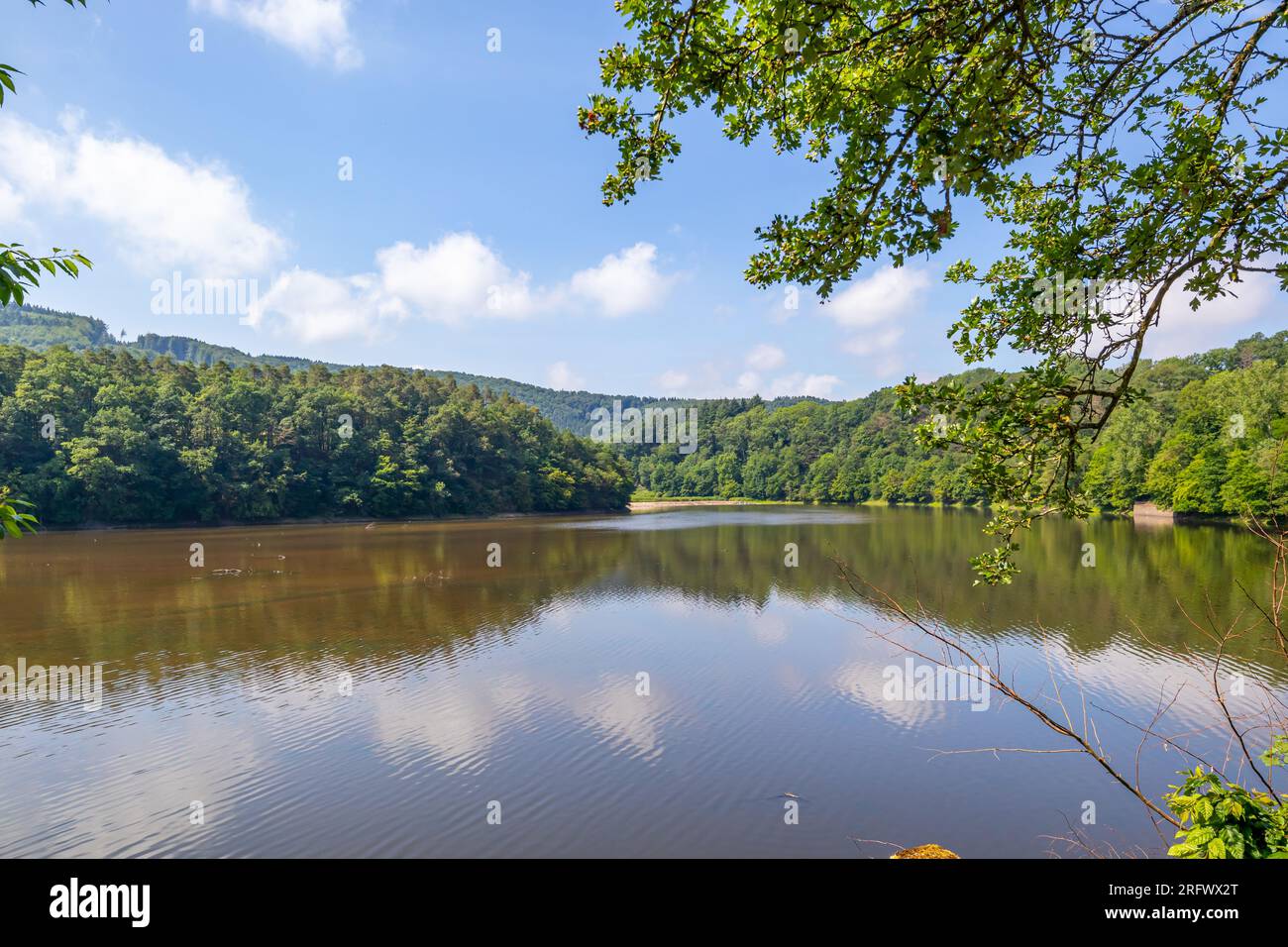 Stausee Bitburg lake landscape with reflection on water surface ...