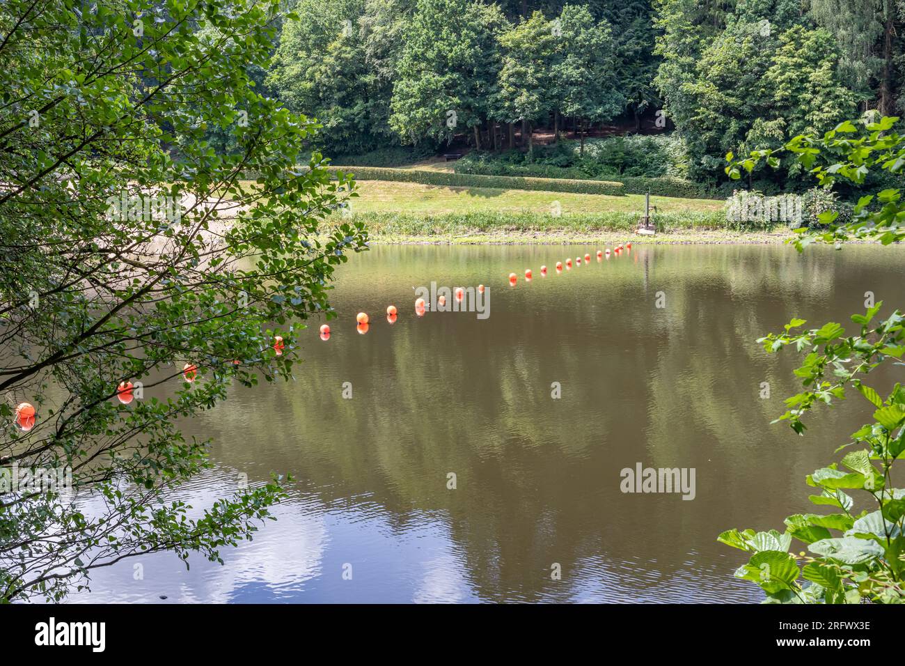 Prum river in Stausee Bitburg reservoir with orange buoys and ...