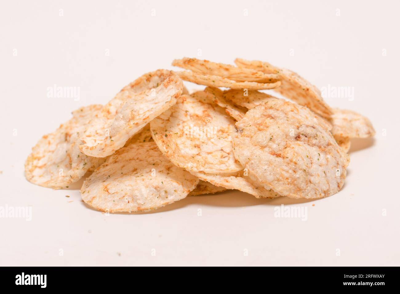 Rice chips isolated on a white background Stock Photo - Alamy