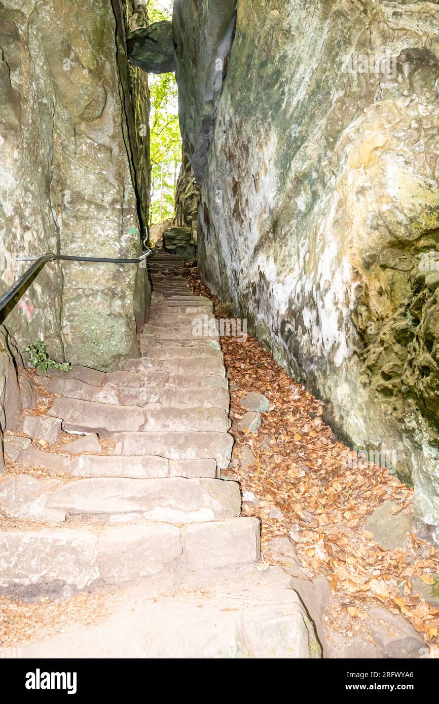 Hiking path with a staircase between narrow groove between two rock ...