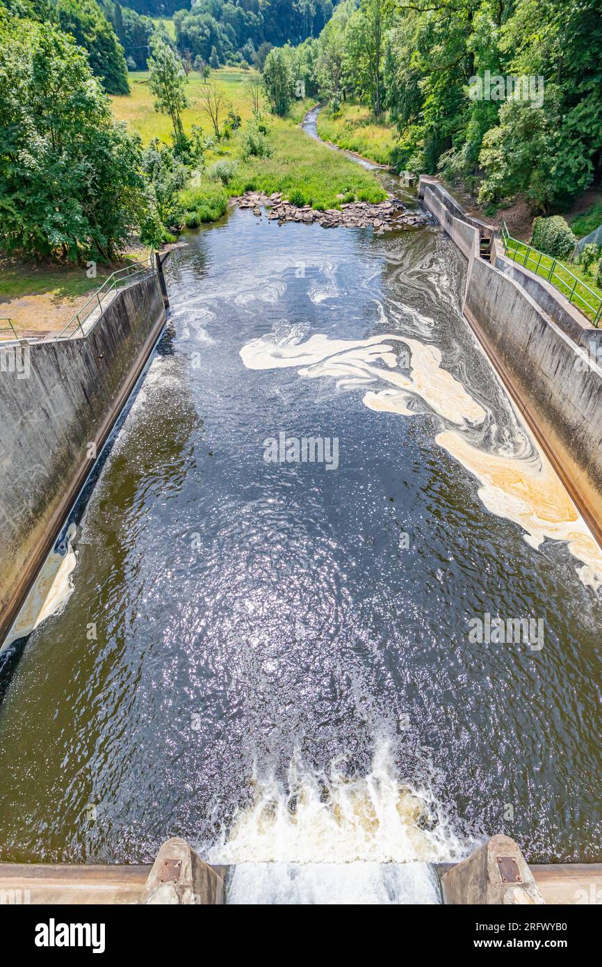 Water running out of gate into canal of Staumauer Bitburger dam on ...