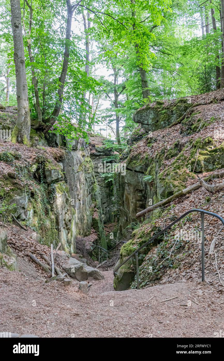 Staircase descending into narrow slot between two rock formations in ...