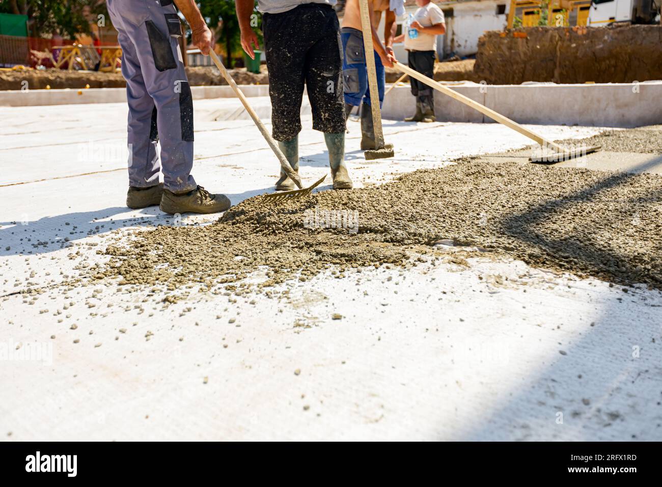 Construction workers, riggers are using rake and wooden handmade ...