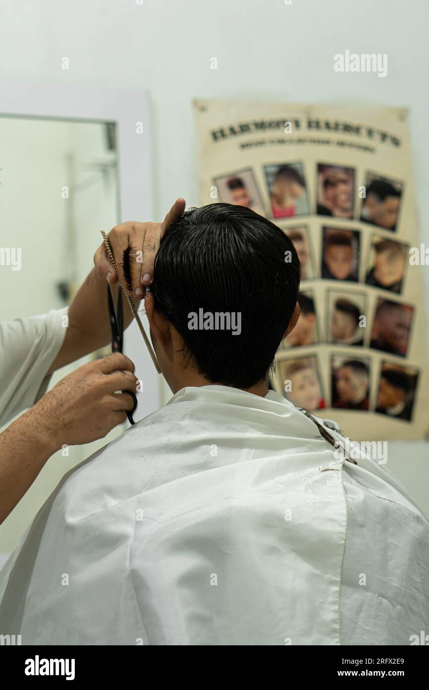 hair cut in barbershop asian people Stock Photo - Alamy
