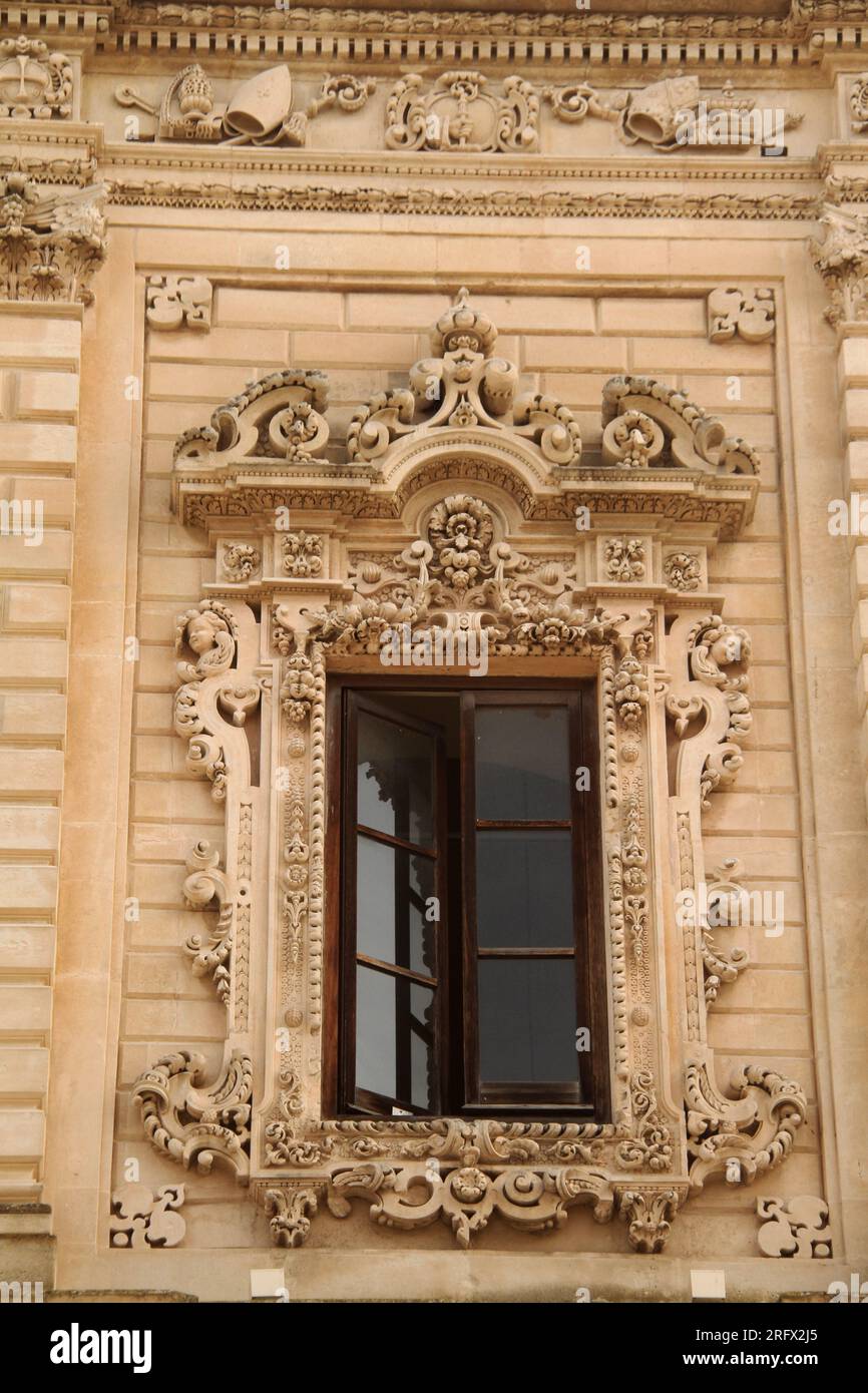 Lecce, Italy. Close-up of the richly decorated window frames of the XVI ...
