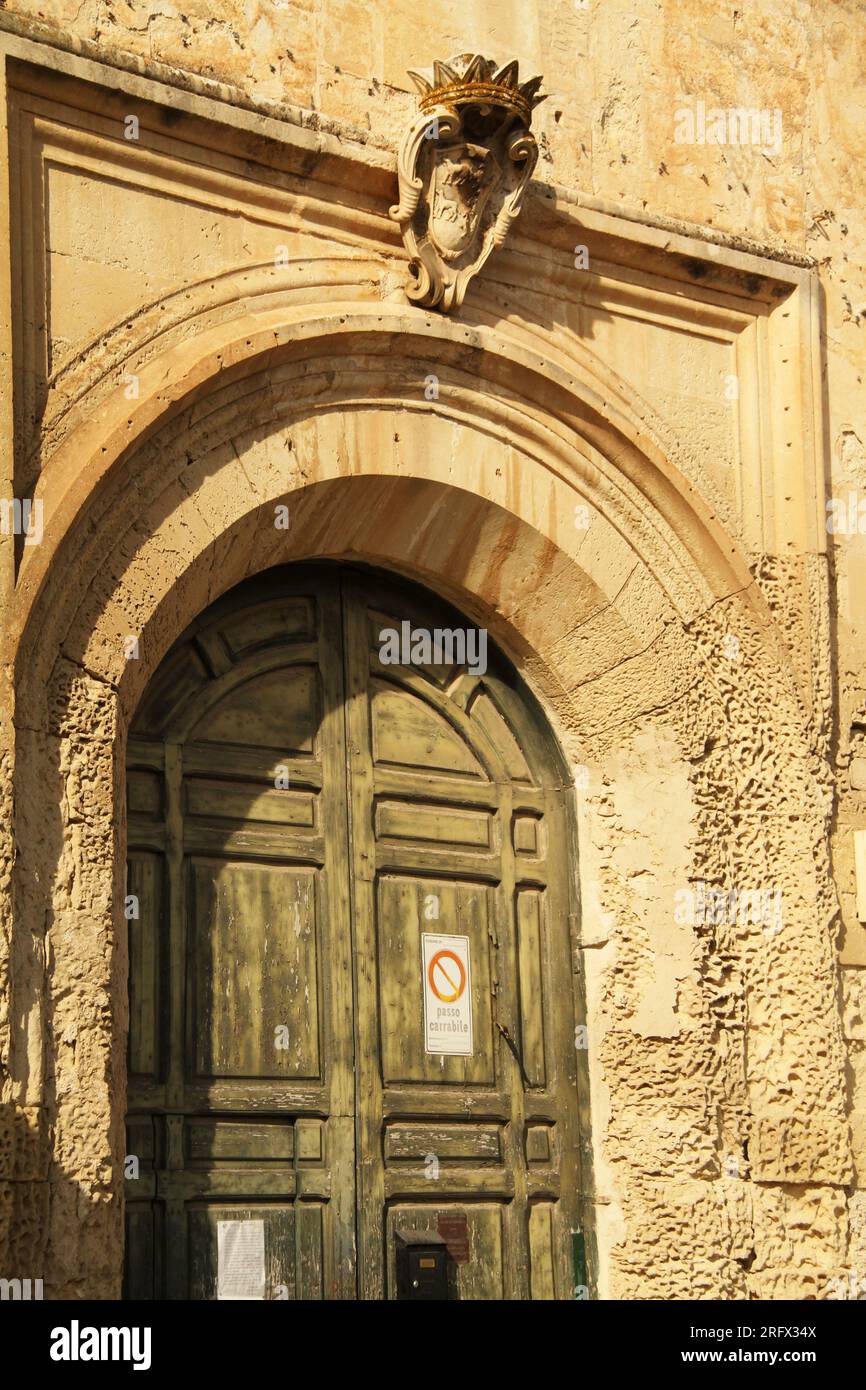 Arched entryway with keystone in the historical center of Lecce, Italy ...