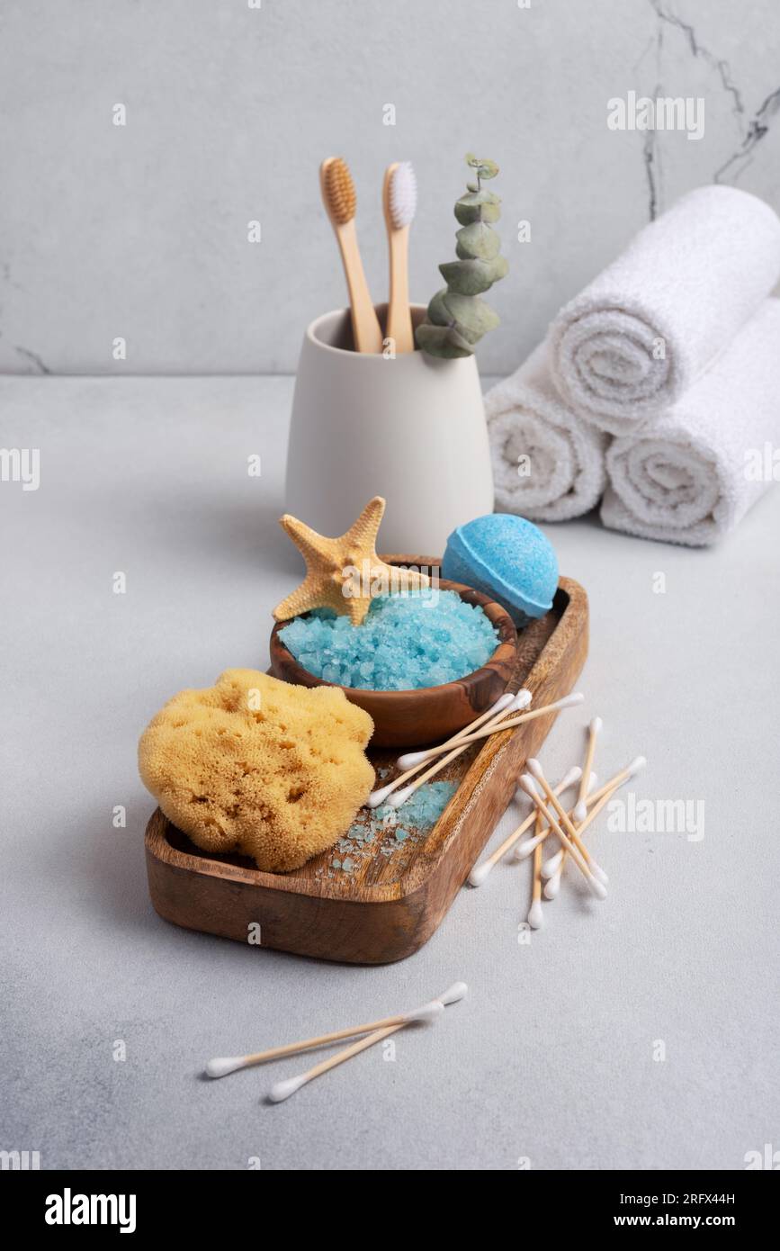 Bath Spa Setting with blue sea salt, natural wild sponge and bamboo ...