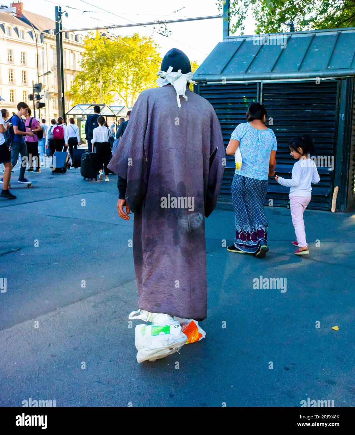 Nantes, France, Poor, Homeless Man Walking Away on Street in CIty ...
