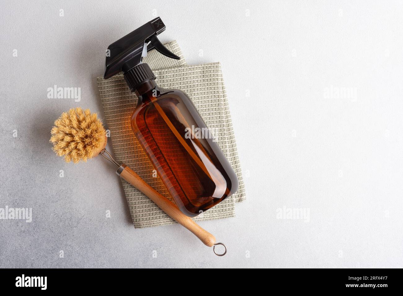 Eco-friendly amber soap bottle and wooden dish brushes. Sustainable ...
