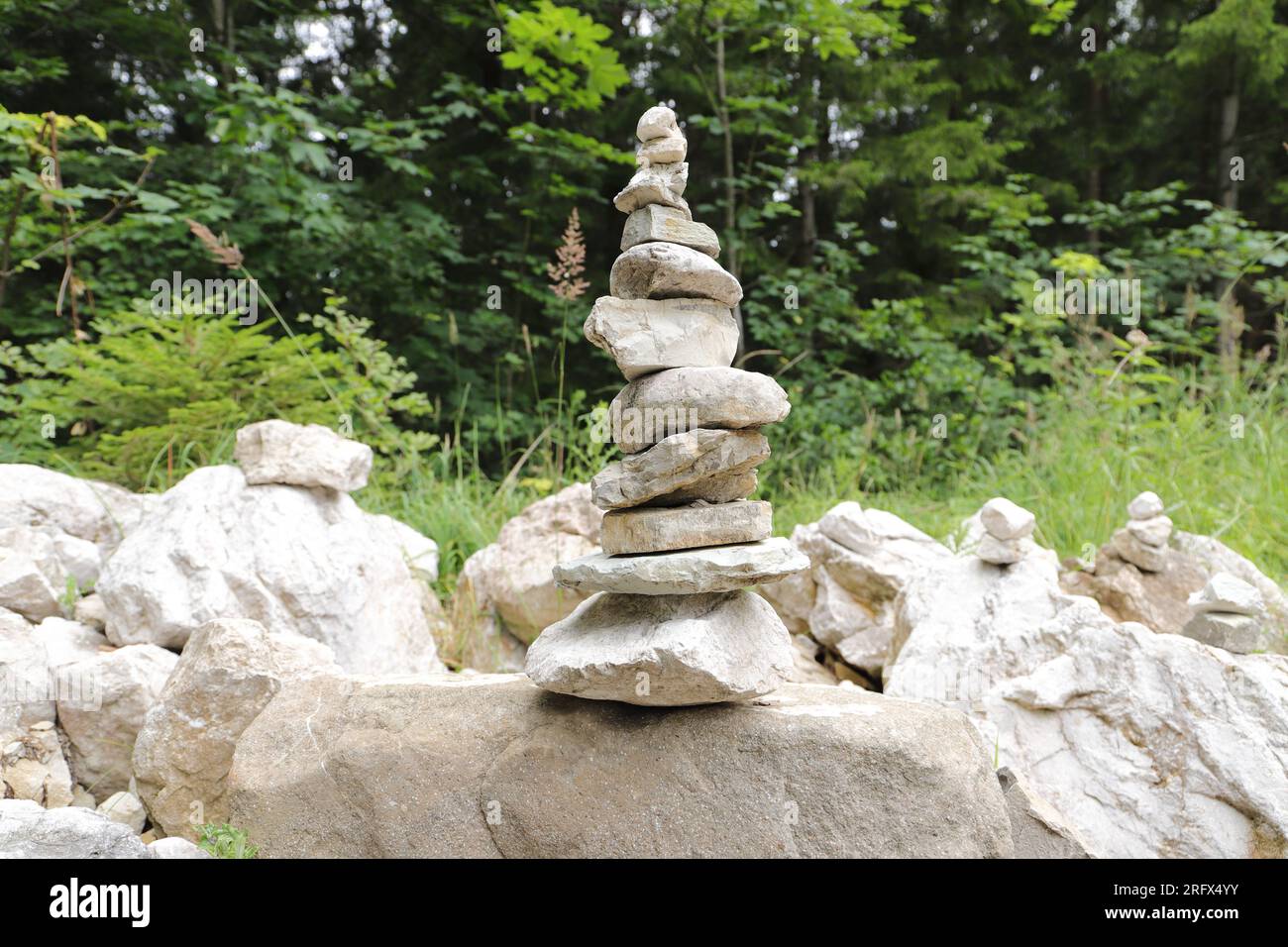 Stone pyramid on a forest path Stock Photo - Alamy