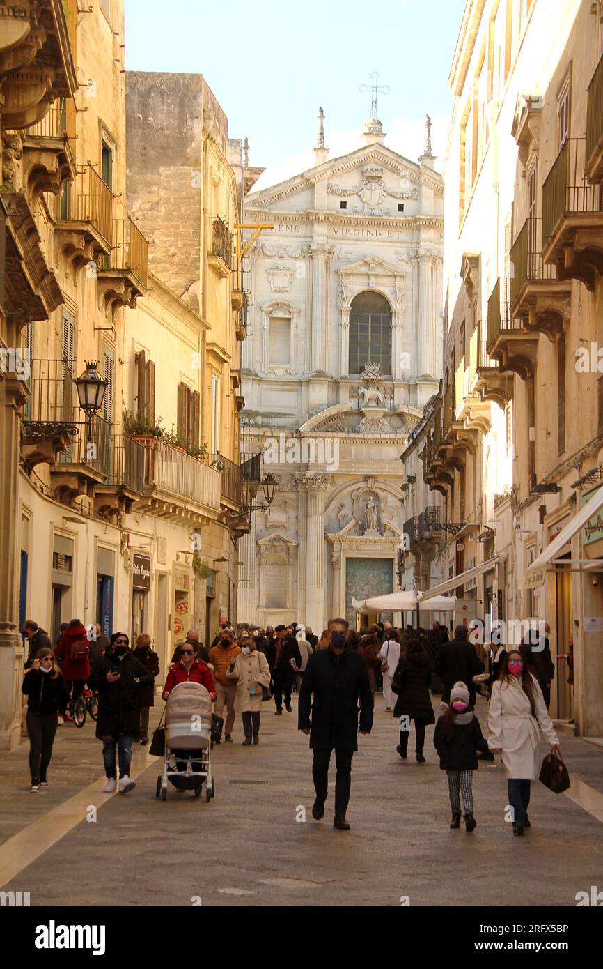 Lecce, Italy. People walking on Via Vittorio Emanuele wearing masks ...