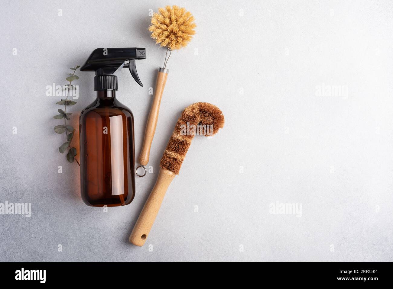 Eco-friendly amber soap bottle and wooden dish brushes. Sustainable ...