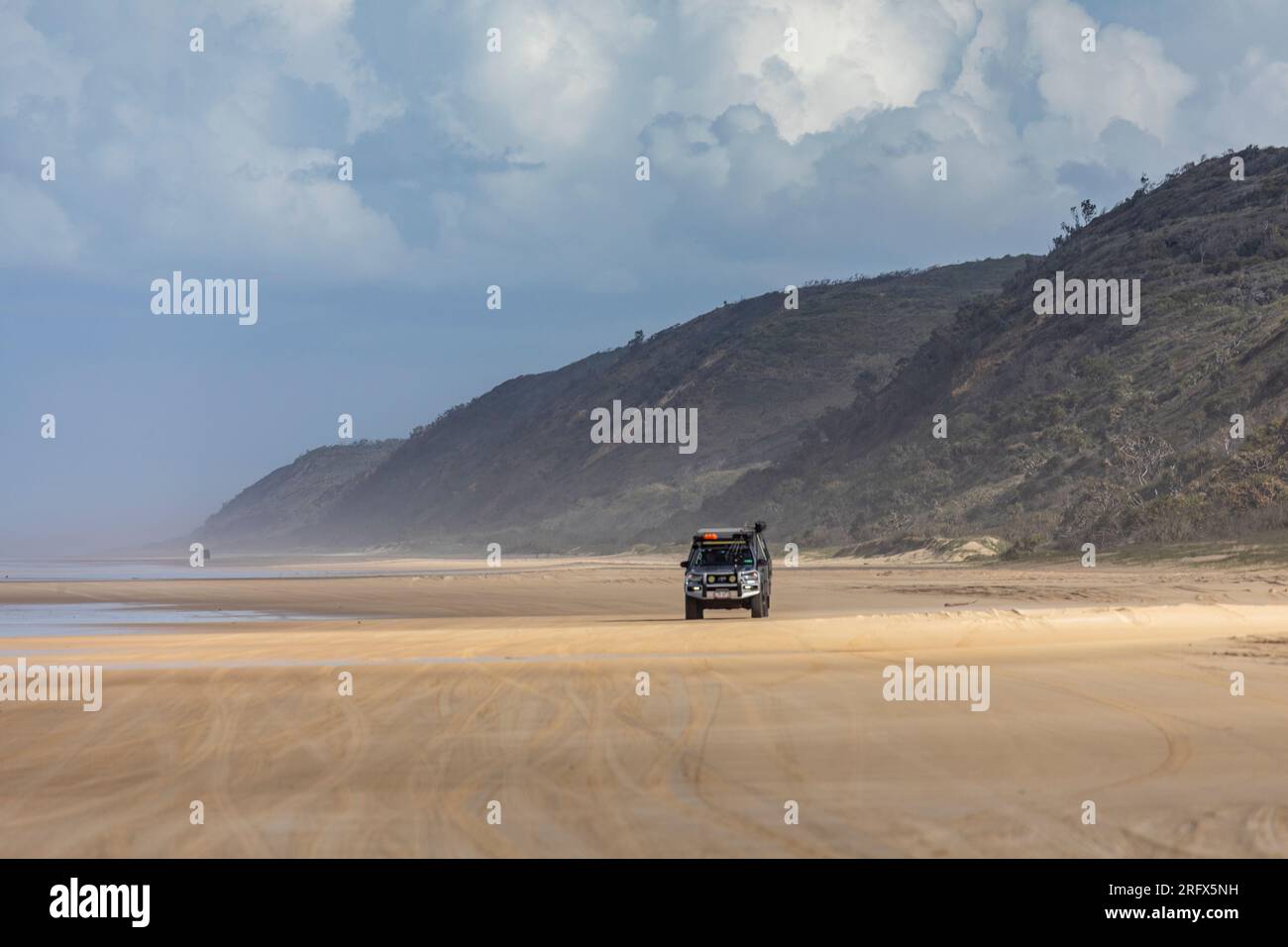 Fraser Island K'gari 75 mile beach sand road and 4WD vehicle driving on ...