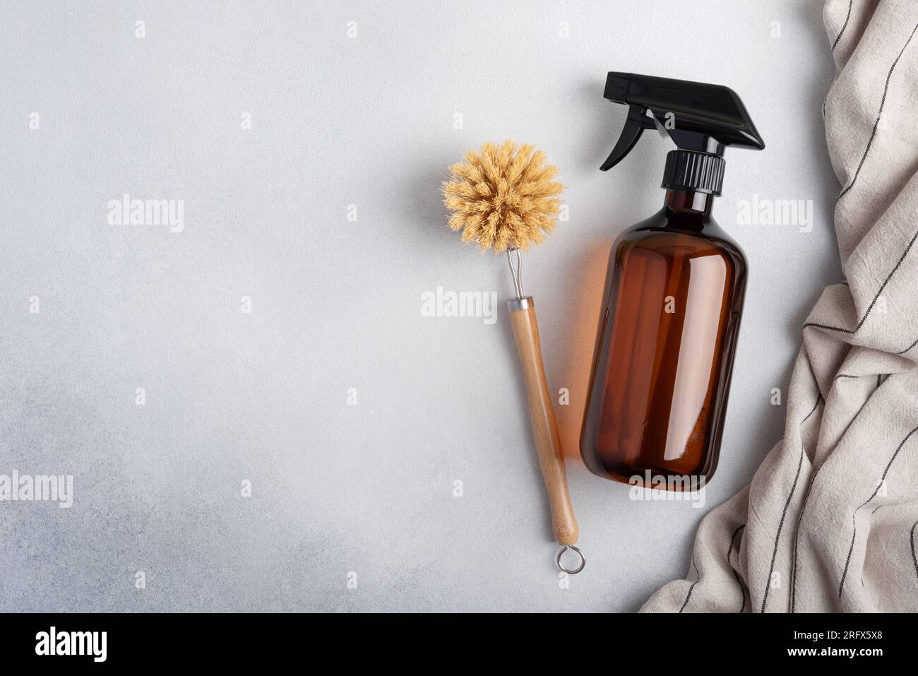 Eco-friendly amber soap bottle and wooden dish brushes. Sustainable ...