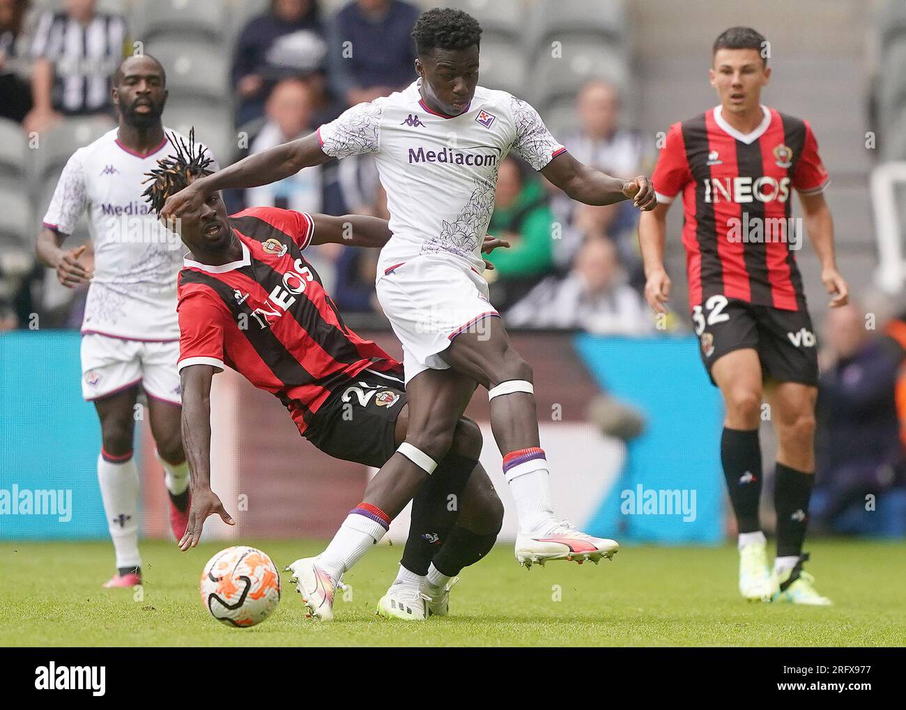 Fiorentina’s Michael Kayode and Nice’s Ewann Gussand battle for the ...
