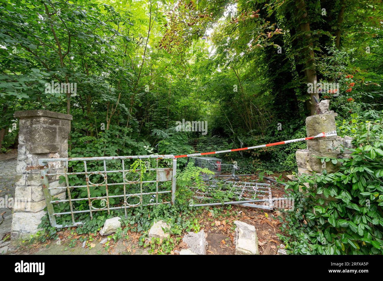 Potsdam, Germany. 06th Aug, 2023. A destroyed fence of the property was ...