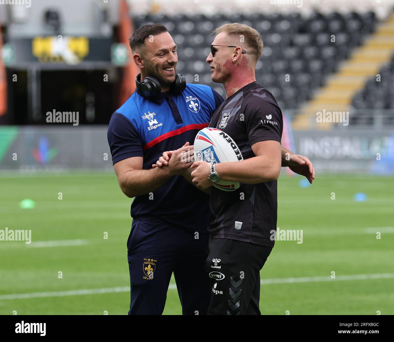 Luke Gale #37 of Wakefield Trinity and Brad Dwyer #33 of Hull FC shake ...