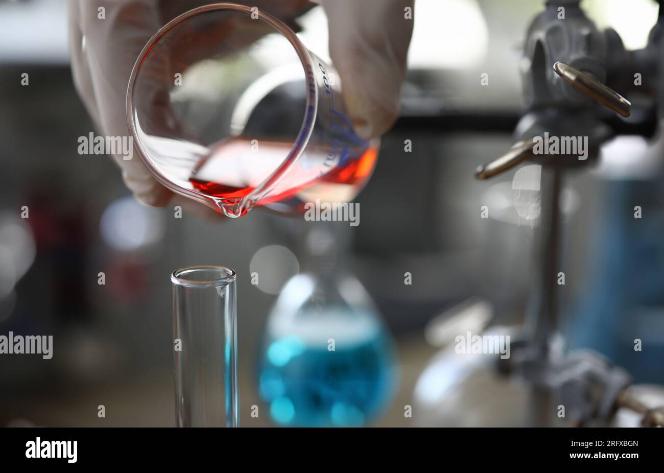 Scientist mixing reagent in test tube Stock Photo - Alamy