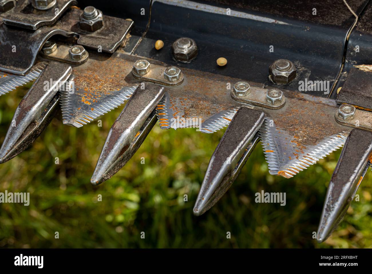 Broken sickle knife on combine harvester soybean platform. Farm ...