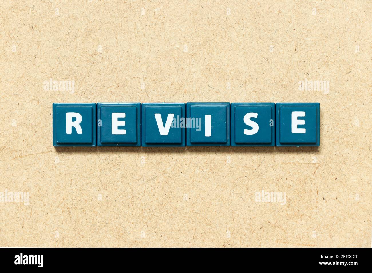 Tile alphabet letter in word revise on wood background Stock Photo - Alamy