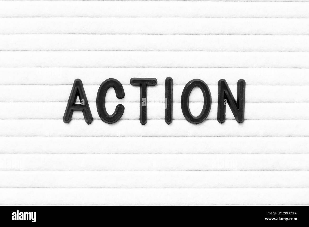 Black color letter in word action on white felt board background Stock ...