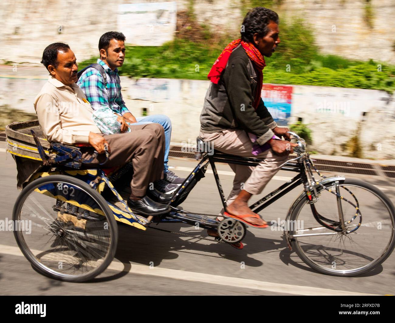 Indian people on a bicycle rickshaw ride in Nainital, Uttarakhand ...