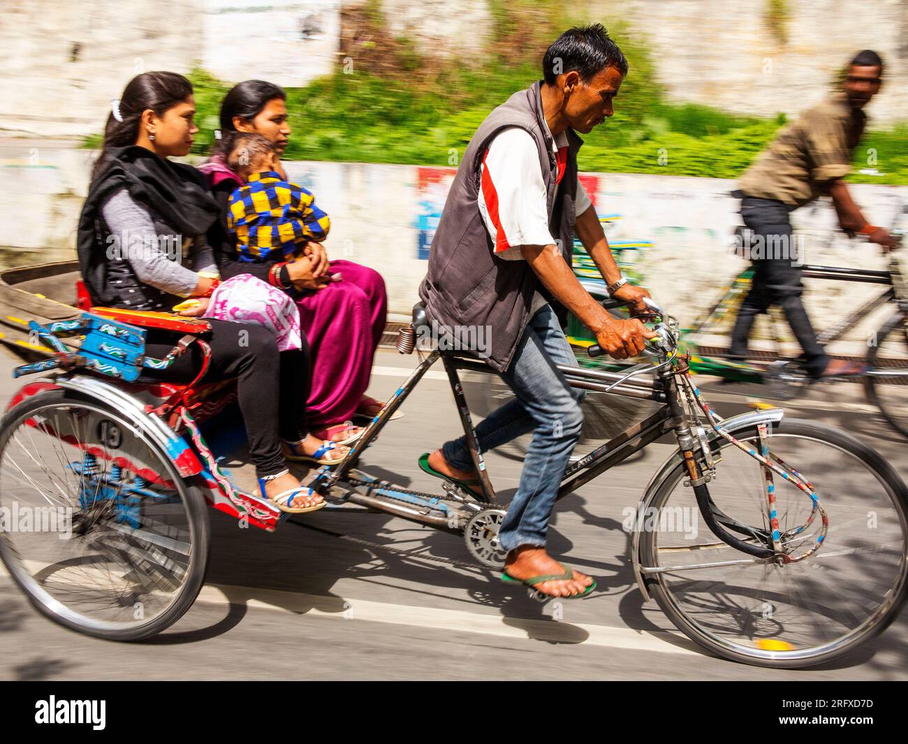 Indian people on a bicycle rickshaw ride in Nainital, Uttarakhand ...