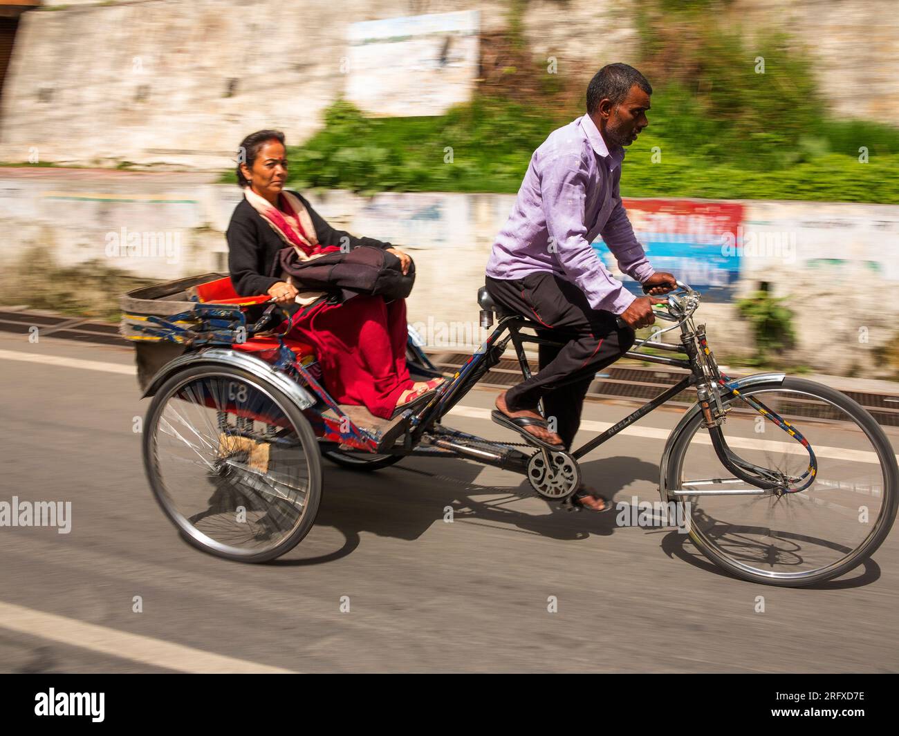 Indian people on a bicycle rickshaw ride in Nainital, Uttarakhand ...