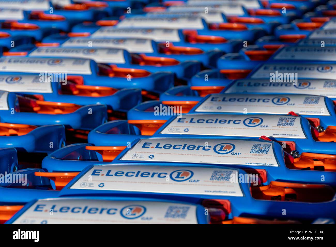 Close-up of a row of many shopping carts branded with the logo of an E ...