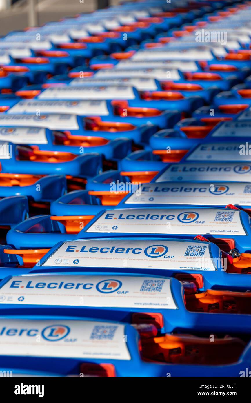 Close-up of a row of many shopping carts branded with the logo of an E ...
