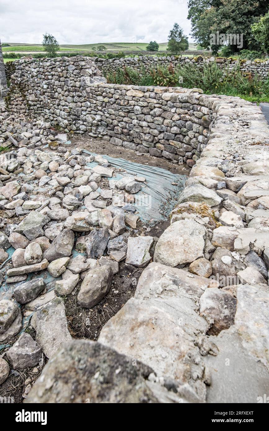 Restoration & rebuild of a stone wall in Long Preston adjacent to ...