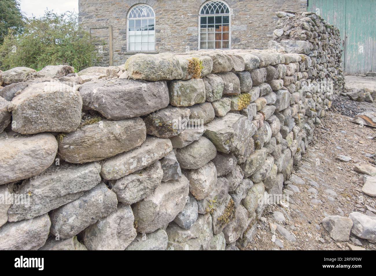 Restoration & rebuild of a stone wall in Long Preston adjacent to ...