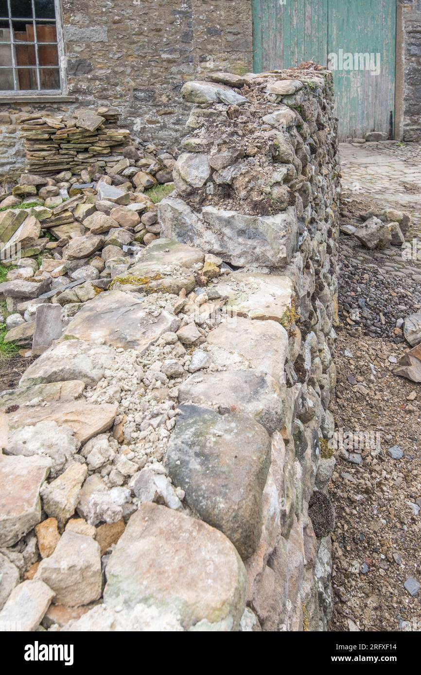 Restoration & rebuild of a stone wall in Long Preston adjacent to ...