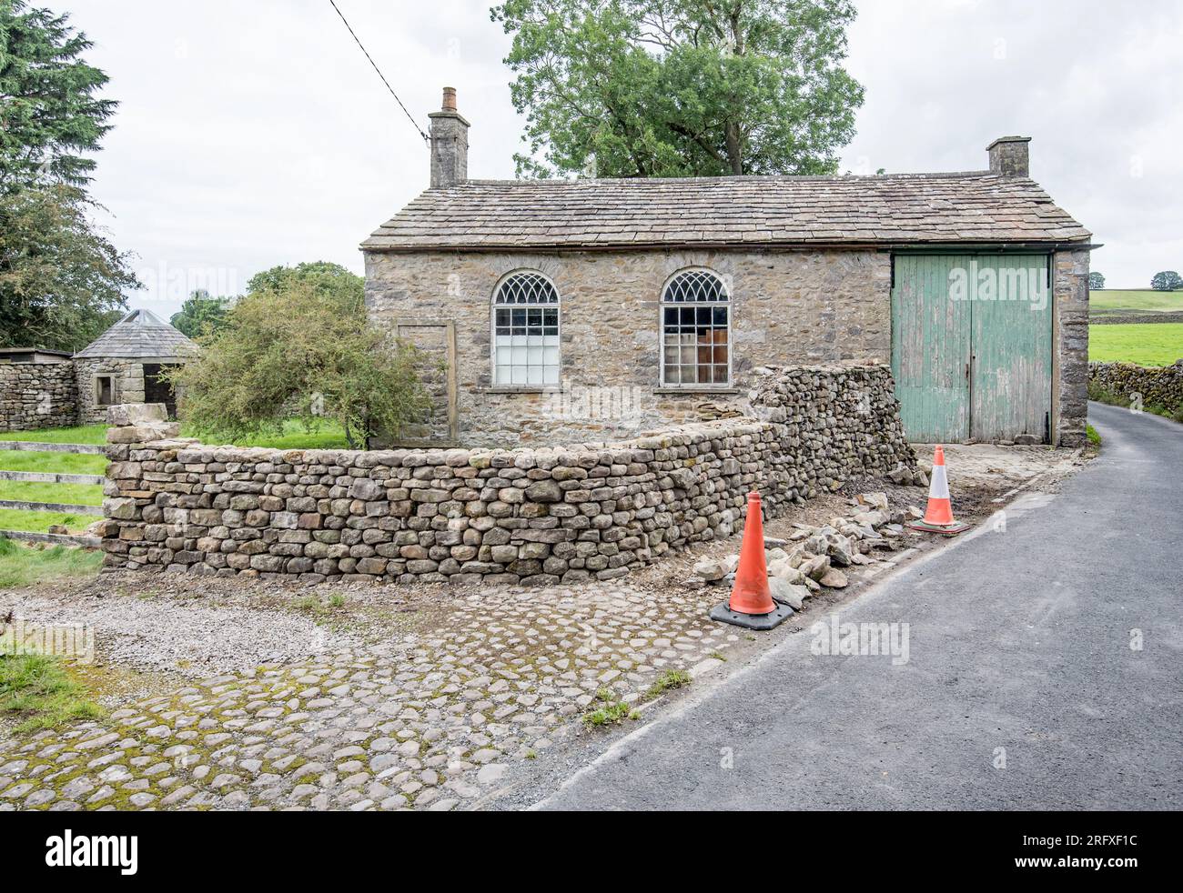Restoration & rebuild of a stone wall in Long Preston adjacent to ...