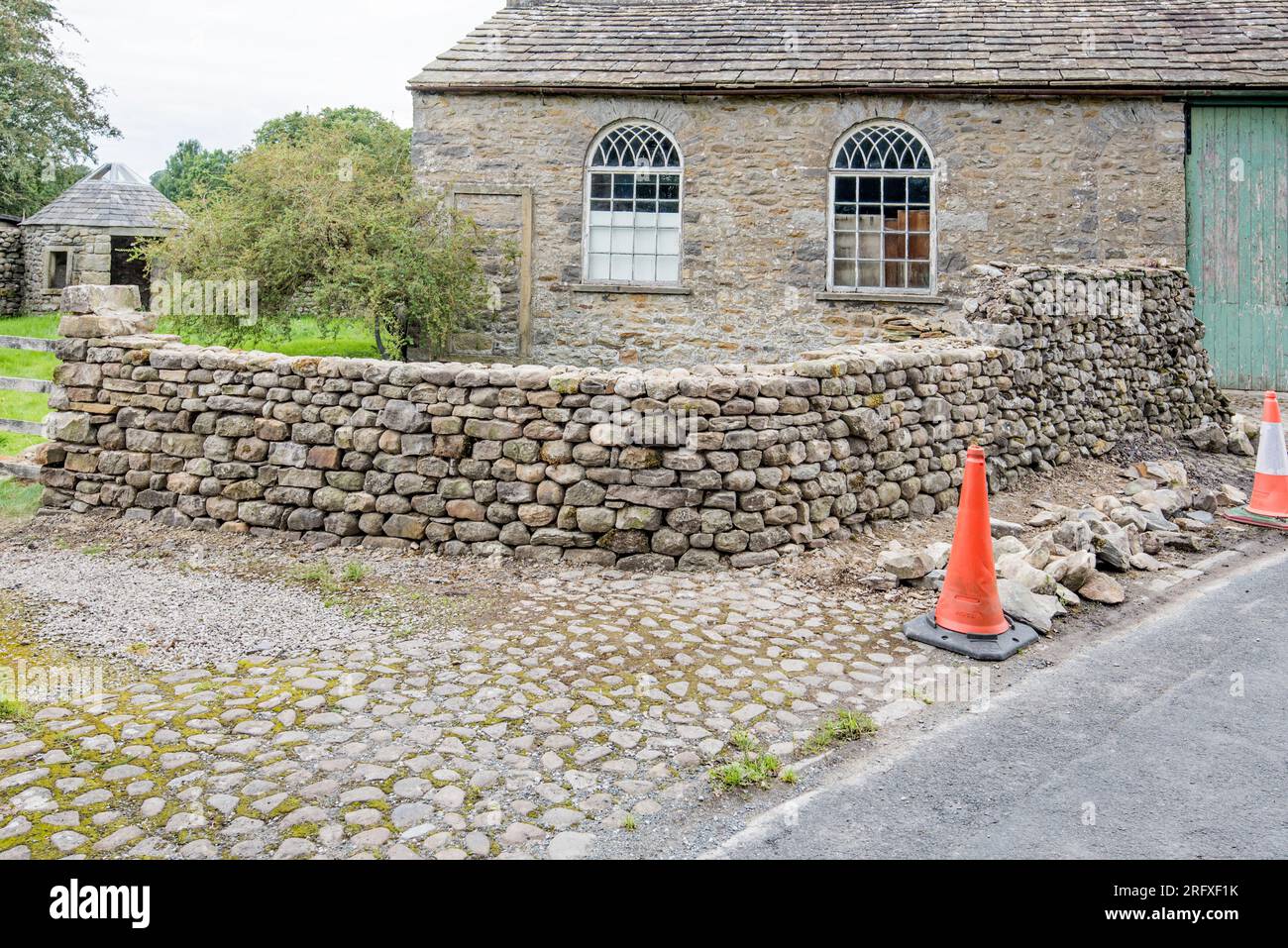 Restoration & rebuild of a stone wall in Long Preston adjacent to ...